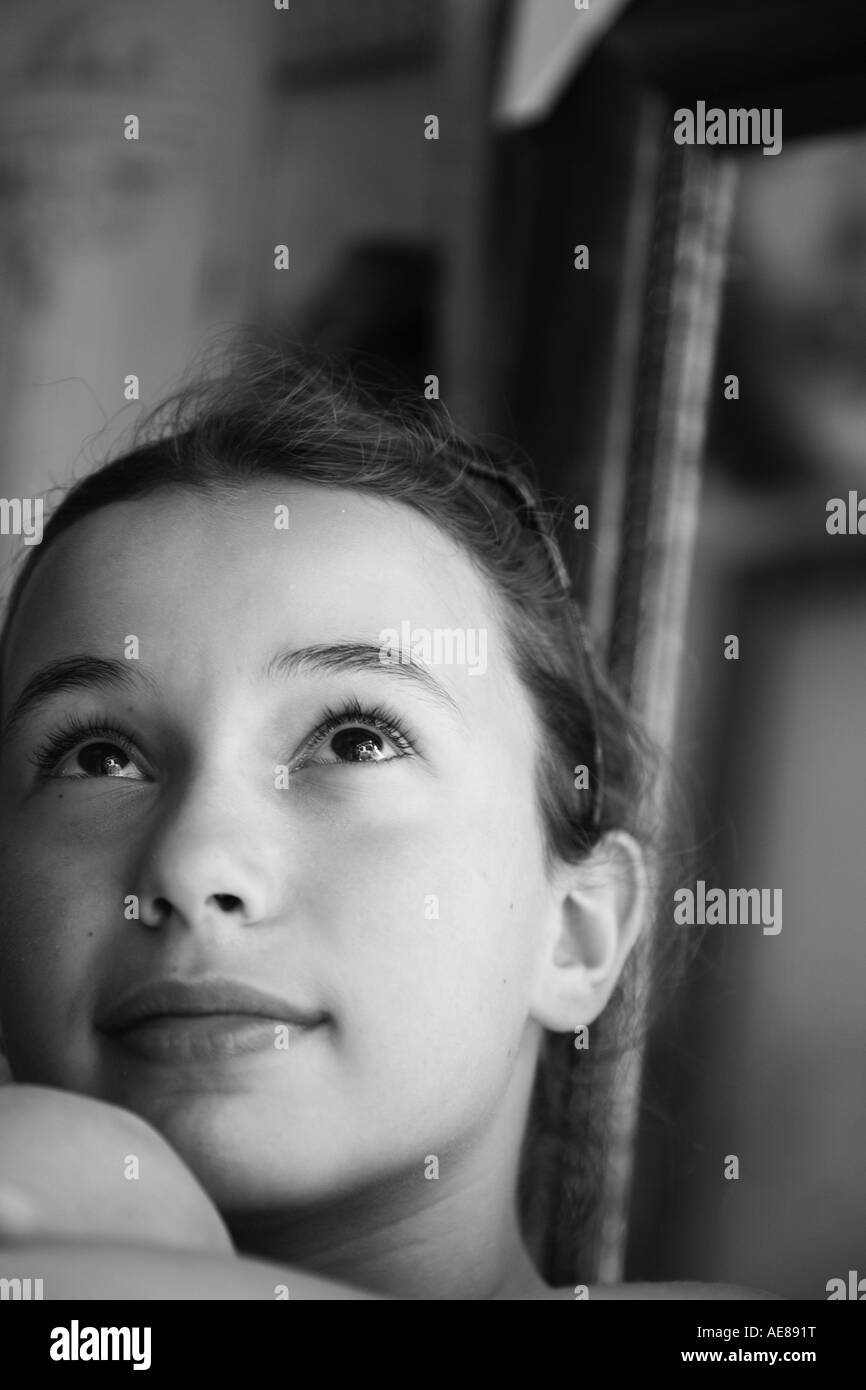 Stock photo portrait of young girl in black and white looking up with a ...