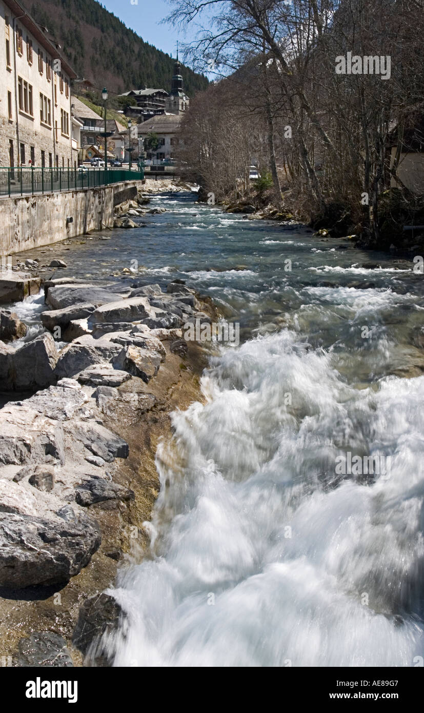 The mountain resort of Morzine, France. Melting snow flows toward La ...