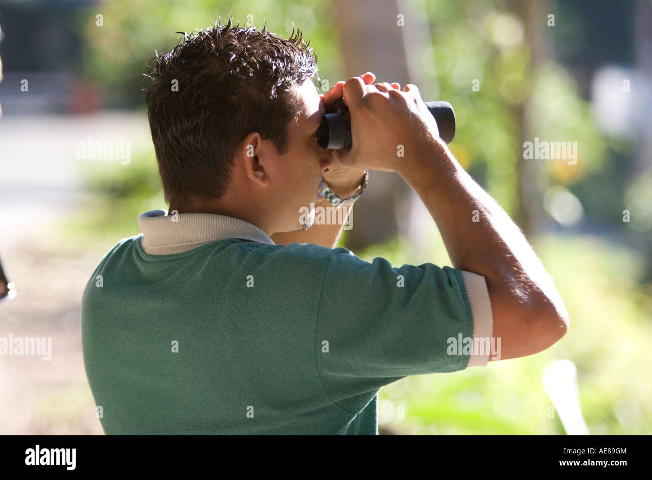 binoculars boy guy look male man Stock Photo - Alamy