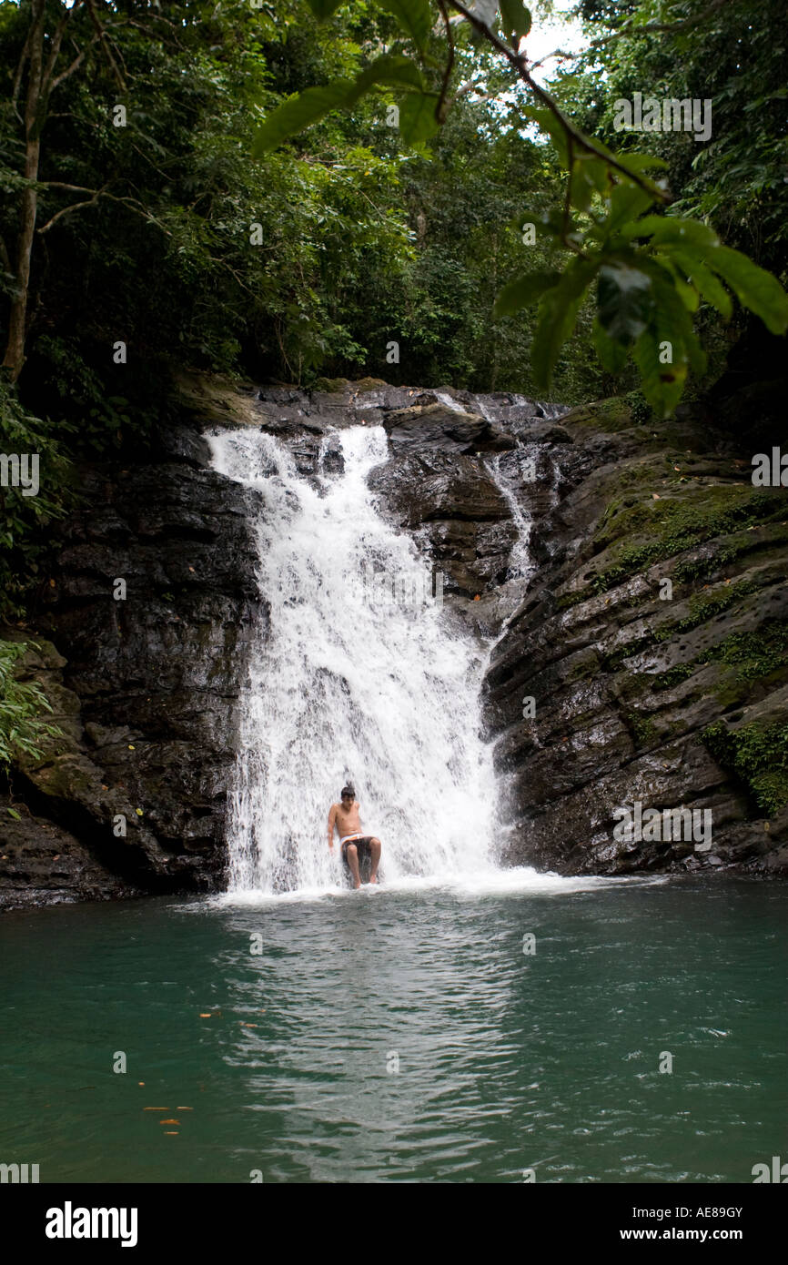 boy swimming in a tropical waterfall Stock Photo - Alamy