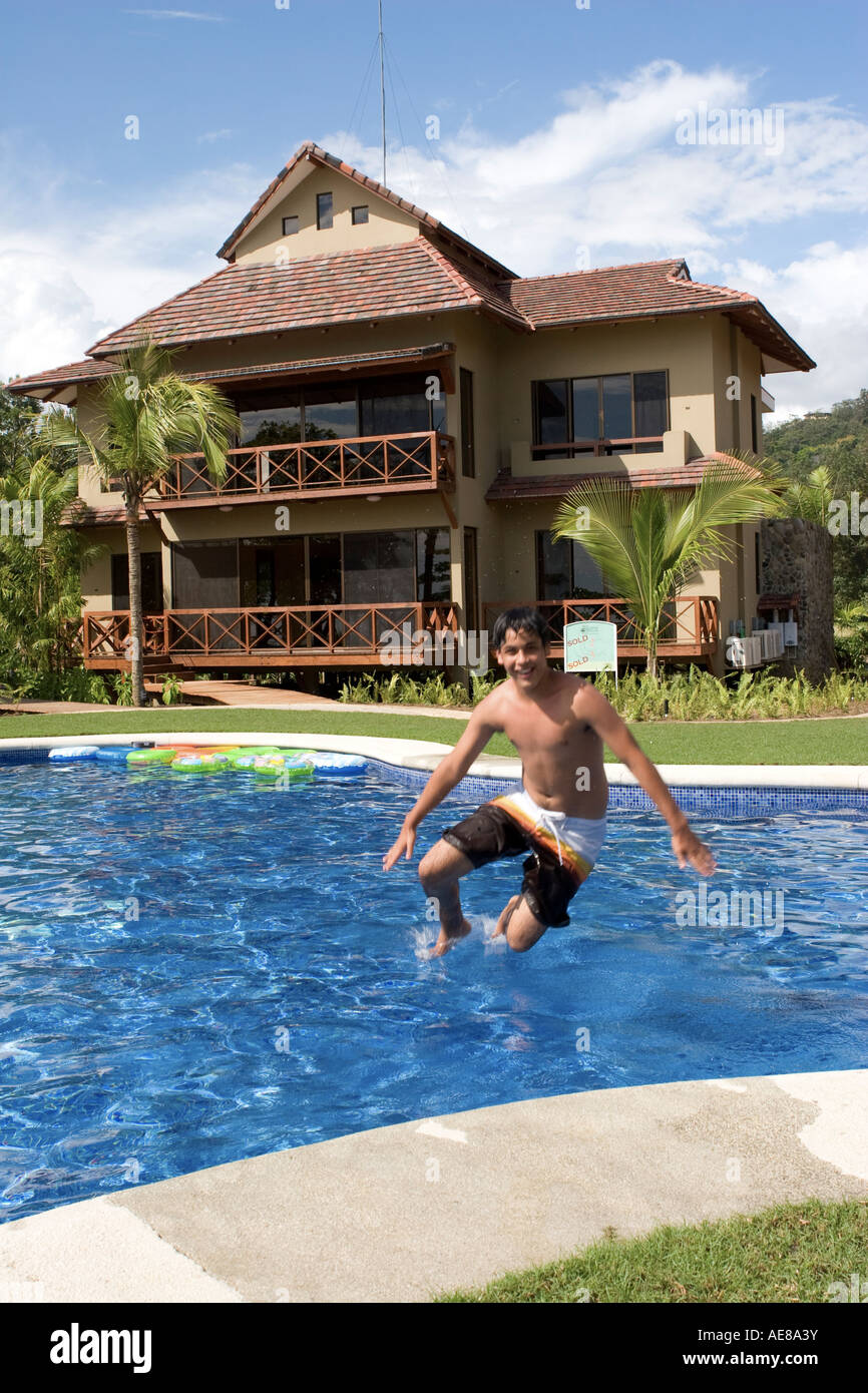 boy jumping into a swimming pool Stock Photo - Alamy