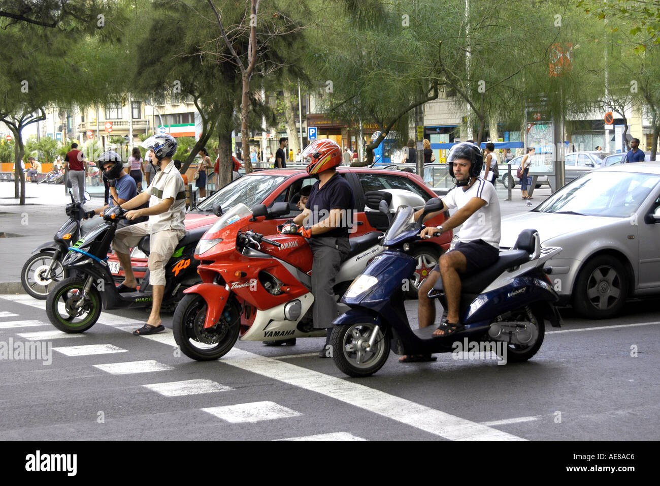 Motor bikes at stoplight Barcelona Spain Stock Photo - Alamy