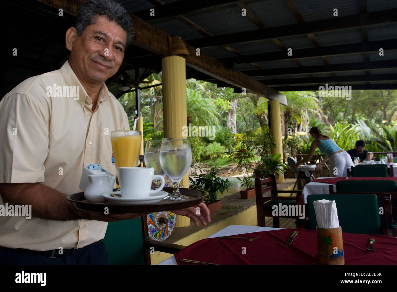 waiter serving breakfast Stock Photo - Alamy