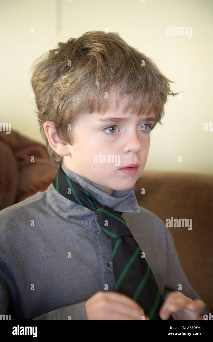 boy tying his tie in the morning getting ready for school Stock Photo ...