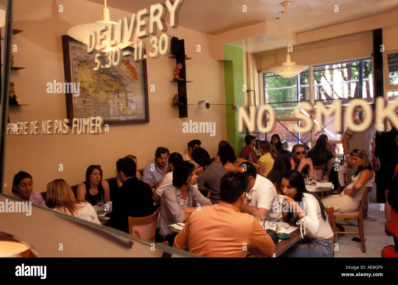 Young people sitting inside the popular cafe Gitane in Nolita neighbourhood Manhattan ny usa ...