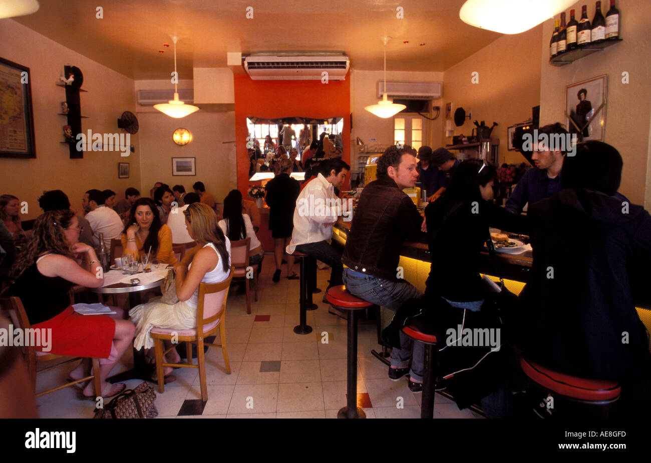 Young people sitting inside the popular cafe Gitane in Nolita neighbourhood Manhattan ny usa ...