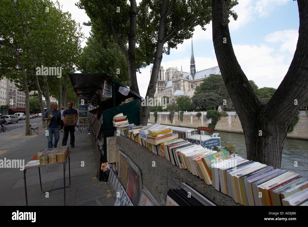 Book seller stalls on the Left Bank with view across the Seine River to ...