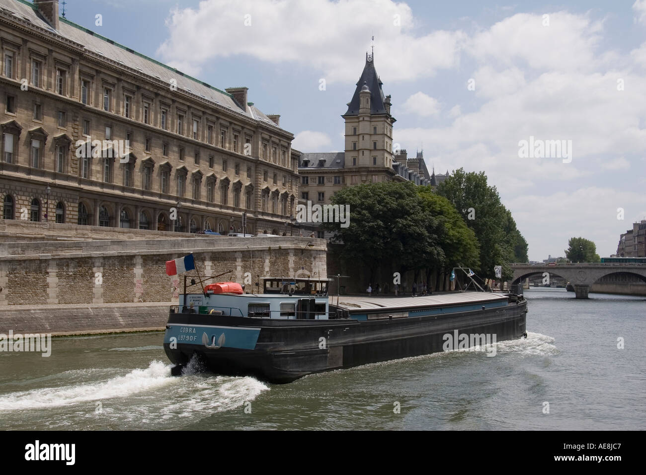 Barge on the Seine River near Pont Au Change Bridge Paris France Stock ...