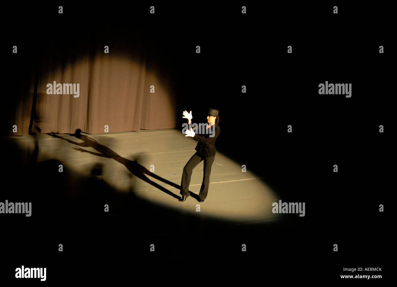 Female jazzdancer in spotlight on stage Stock Photo - Alamy