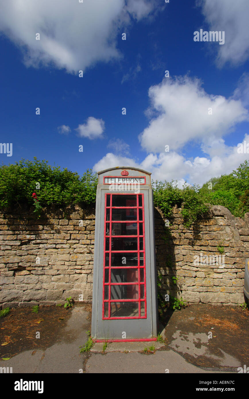 Traditional red telephone box ready for painting covered in grey primer ...