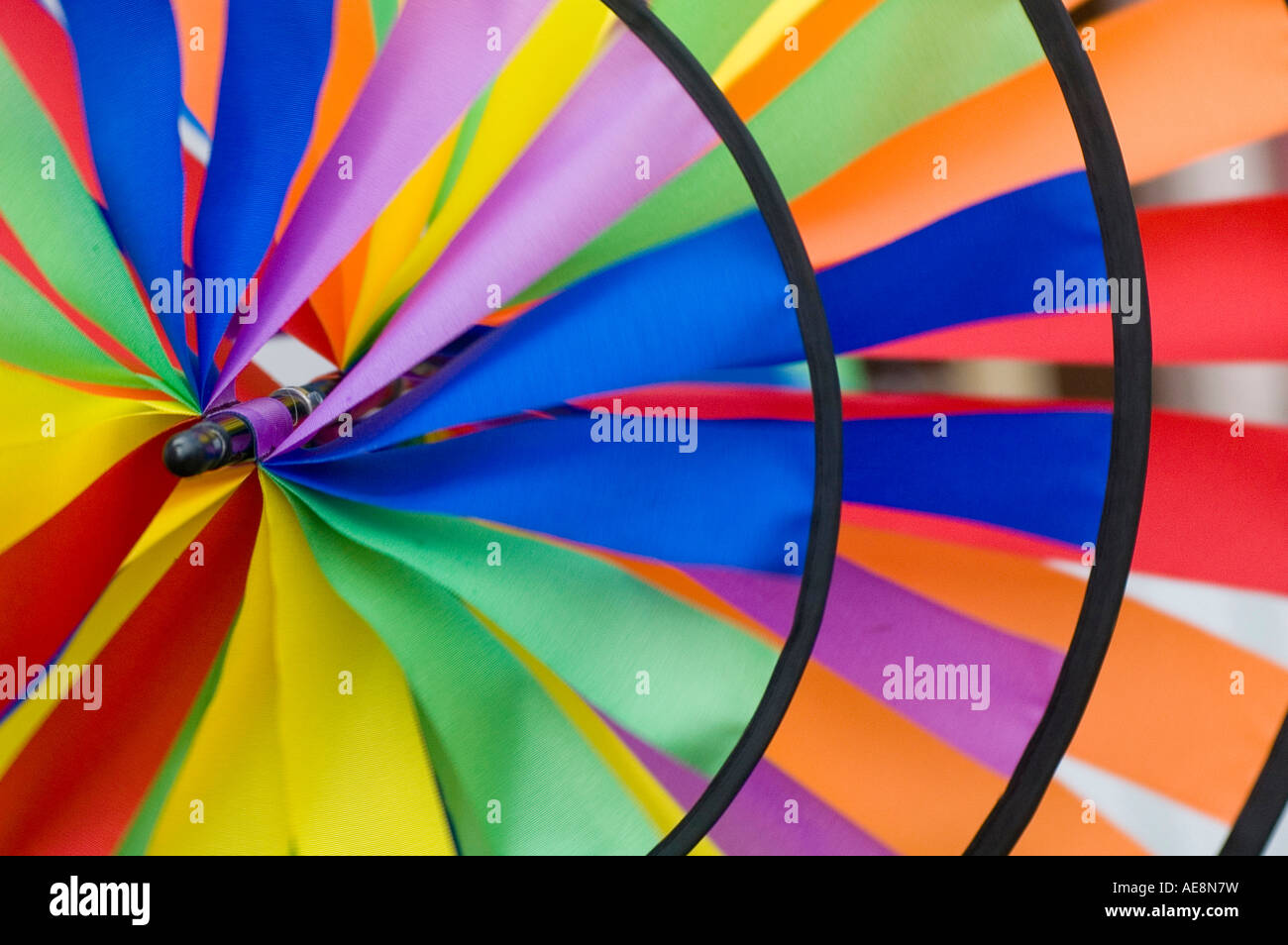 Windmill II. A spiral weather vane or wind vane made of colorful strips ...