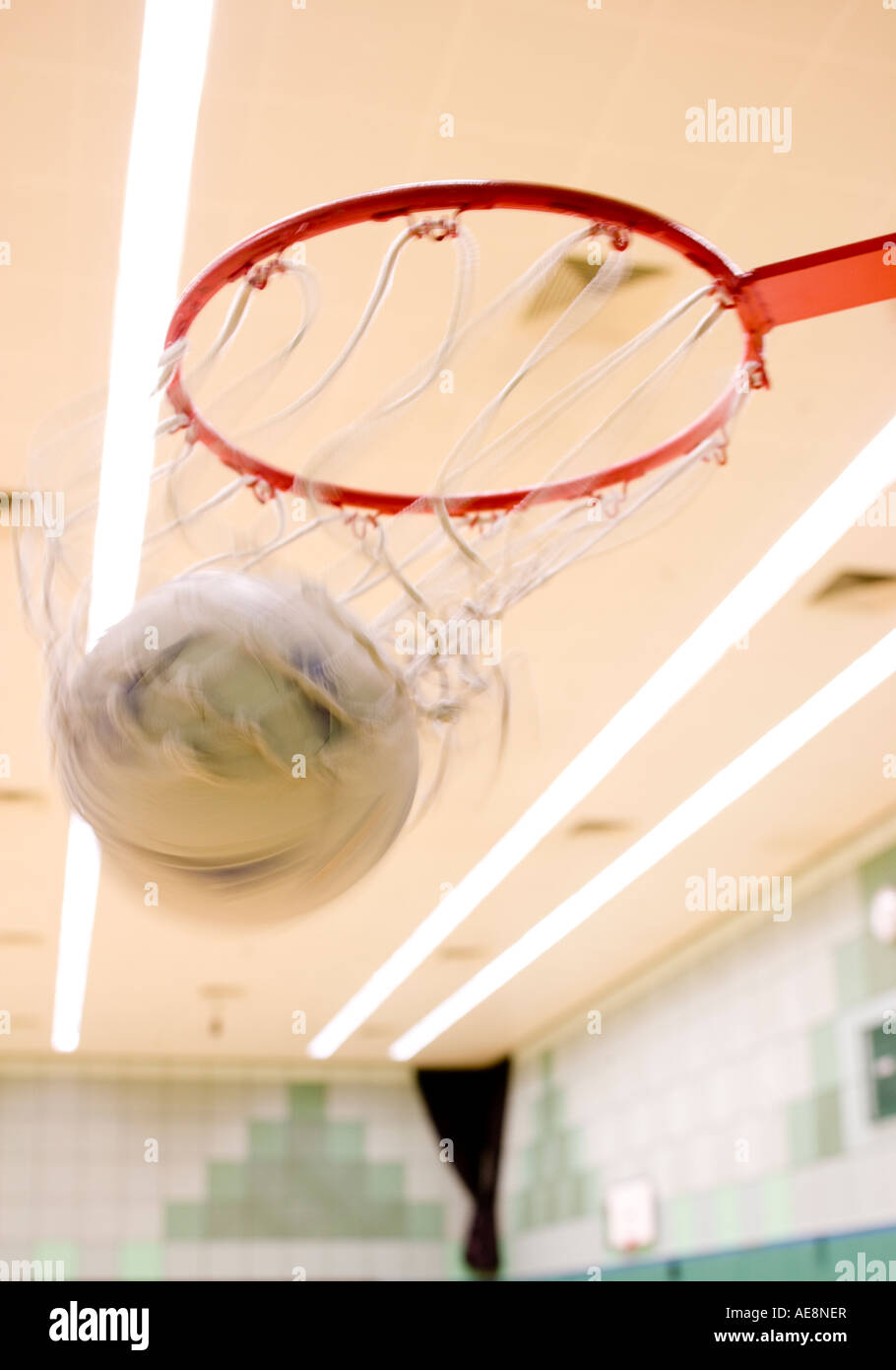 netball goes through hoop Stock Photo - Alamy