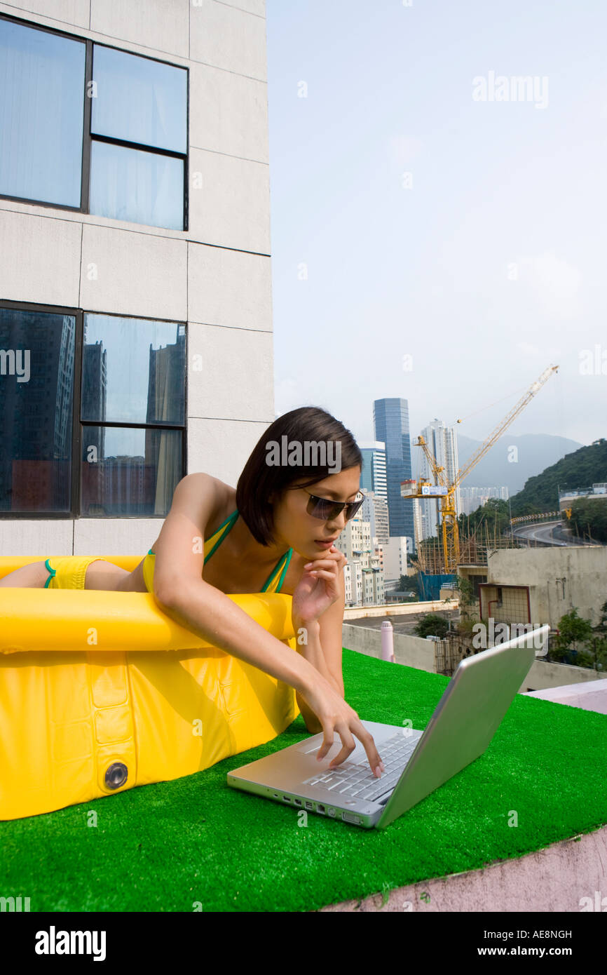 Woman pool inflatable laptop hi-res stock photography and images - Alamy