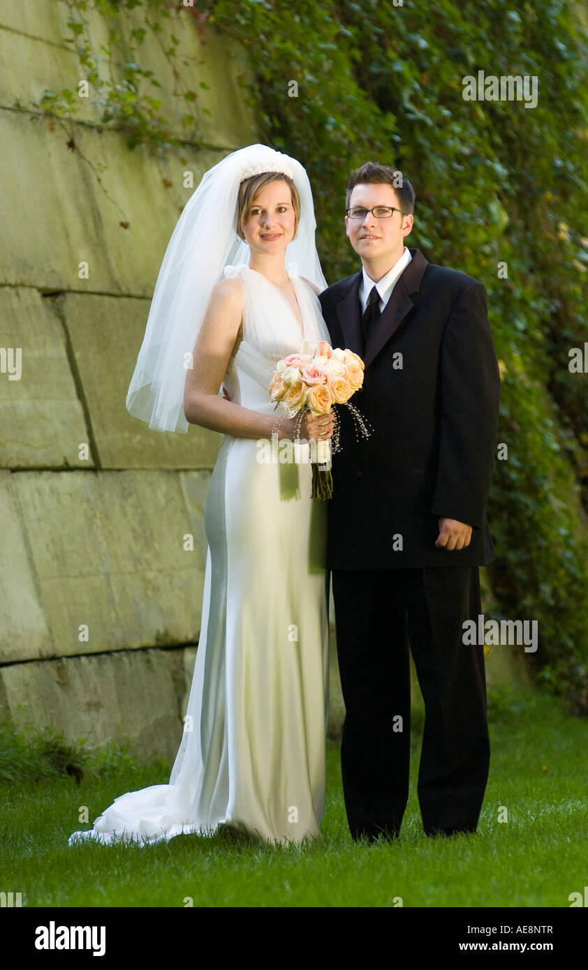 Portrait of bride and bridegroom, full length, outside Stock Photo - Alamy