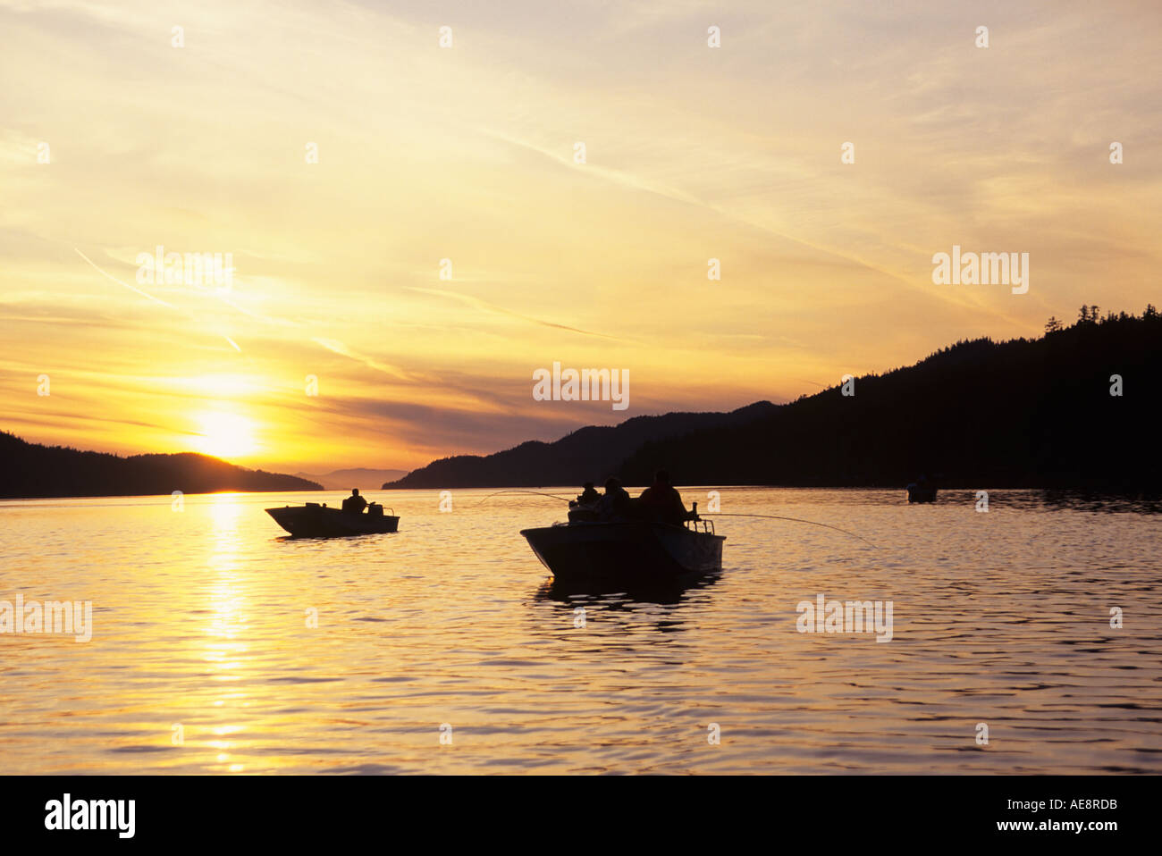 Boats salmon fishing at sunset Work Channel British Columbia Stock ...