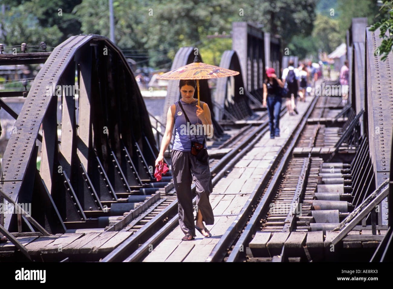 Backpacker crossing river on bridge hi-res stock photography and images ...