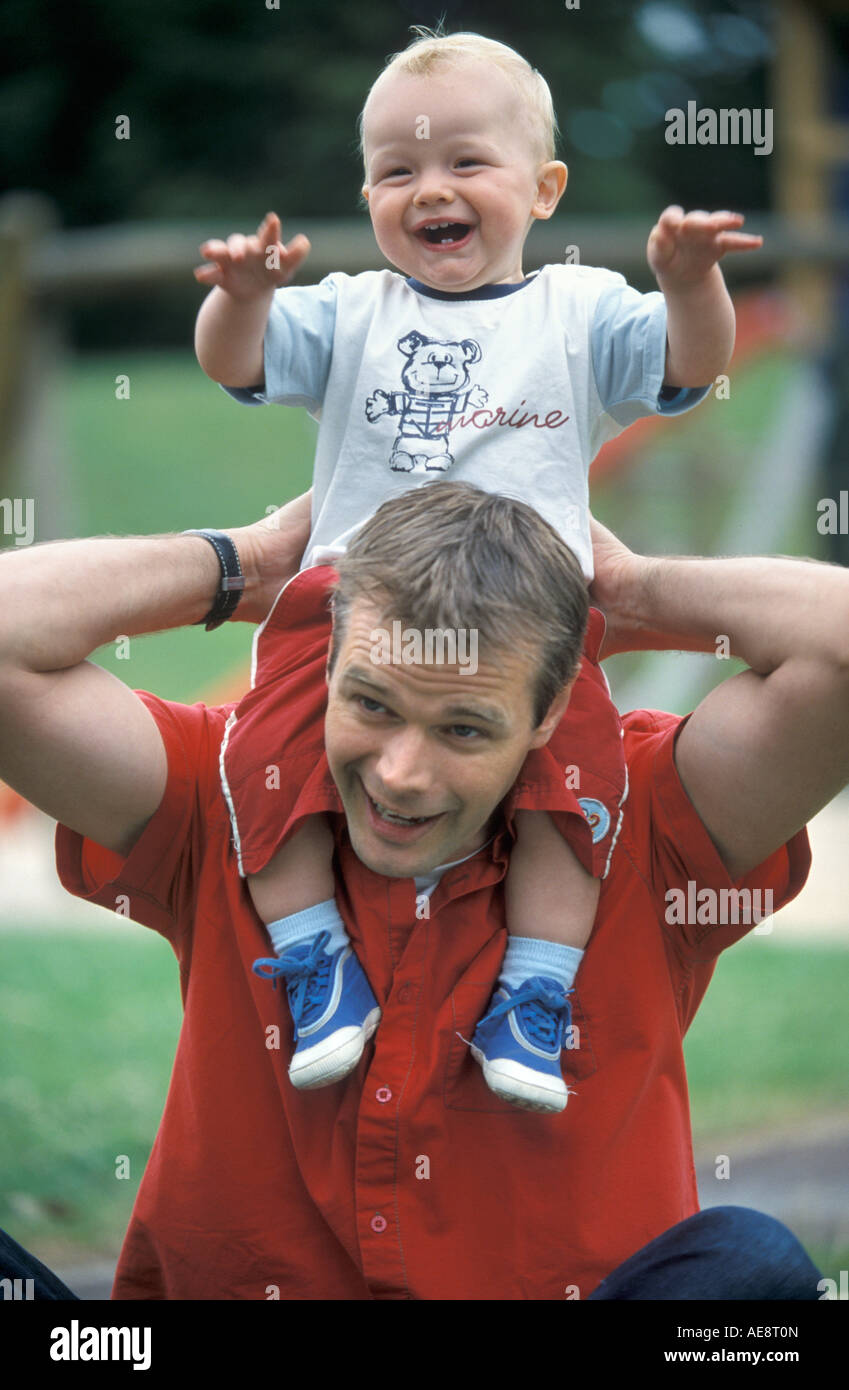 Father is carrying a child on his shoulders Stock Photo - Alamy