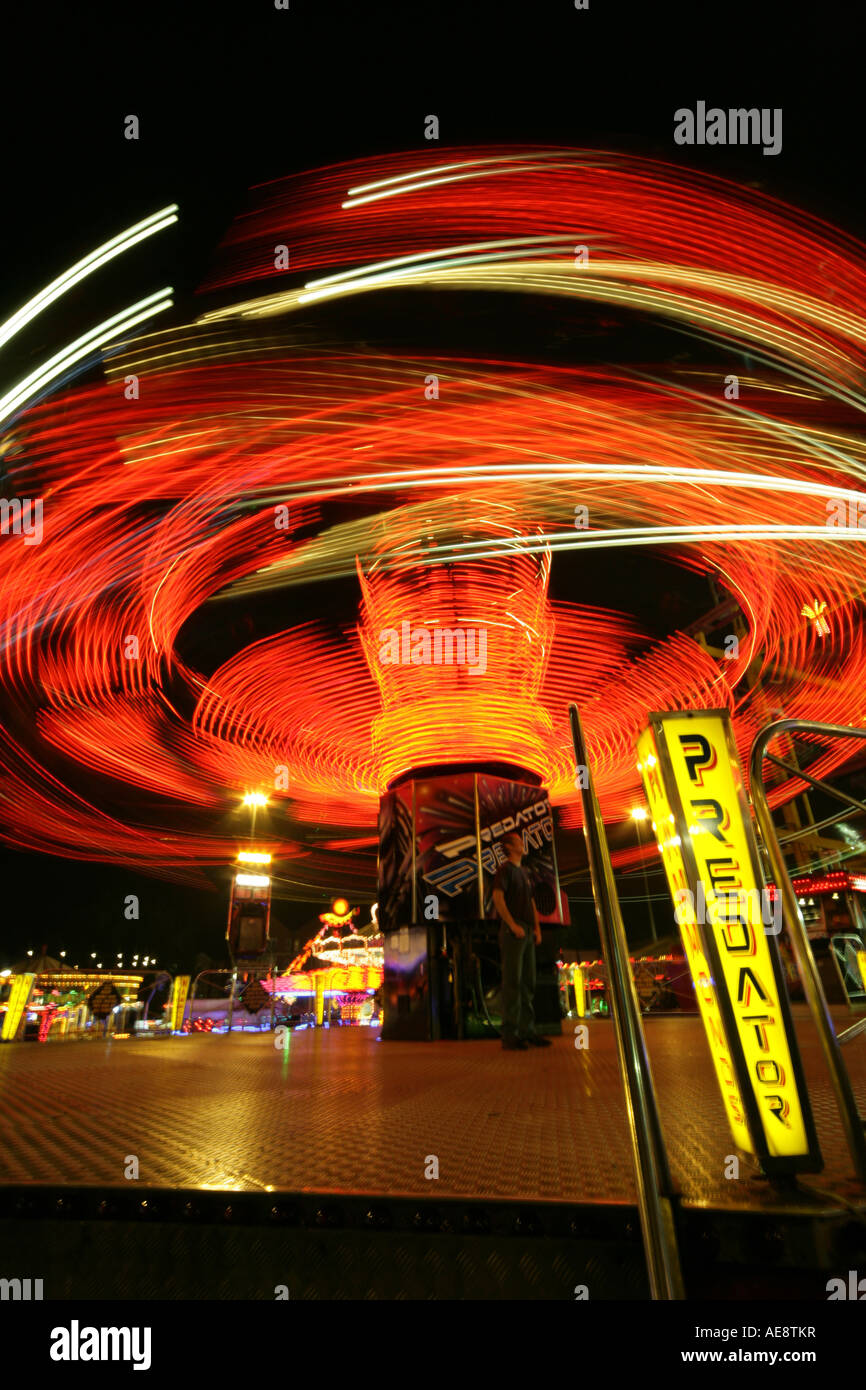 Spinning fair ride in action Stock Photo - Alamy