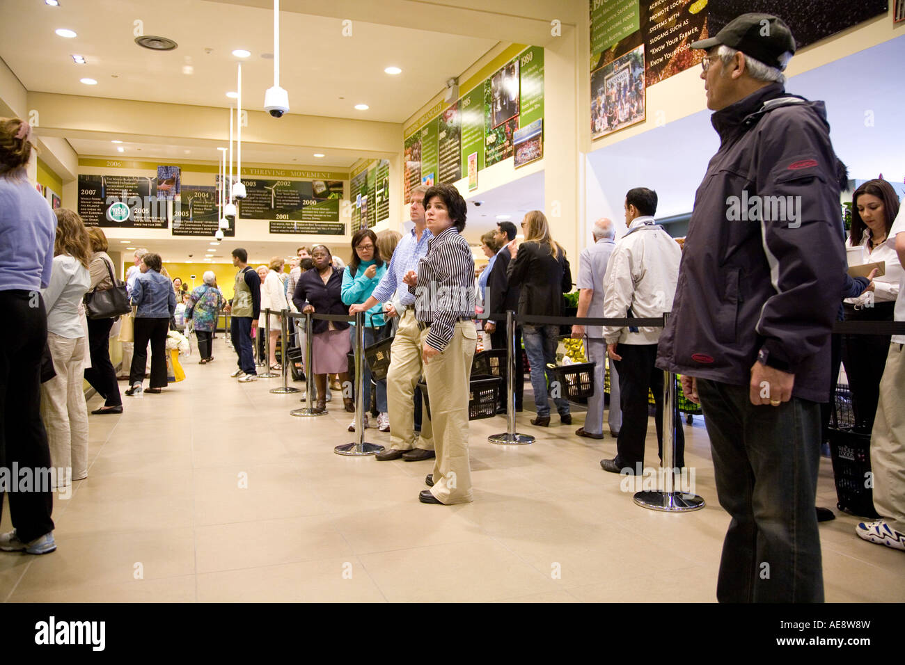 Shoppers queuing up at Wholefoods supermarket on the first day Stock ...