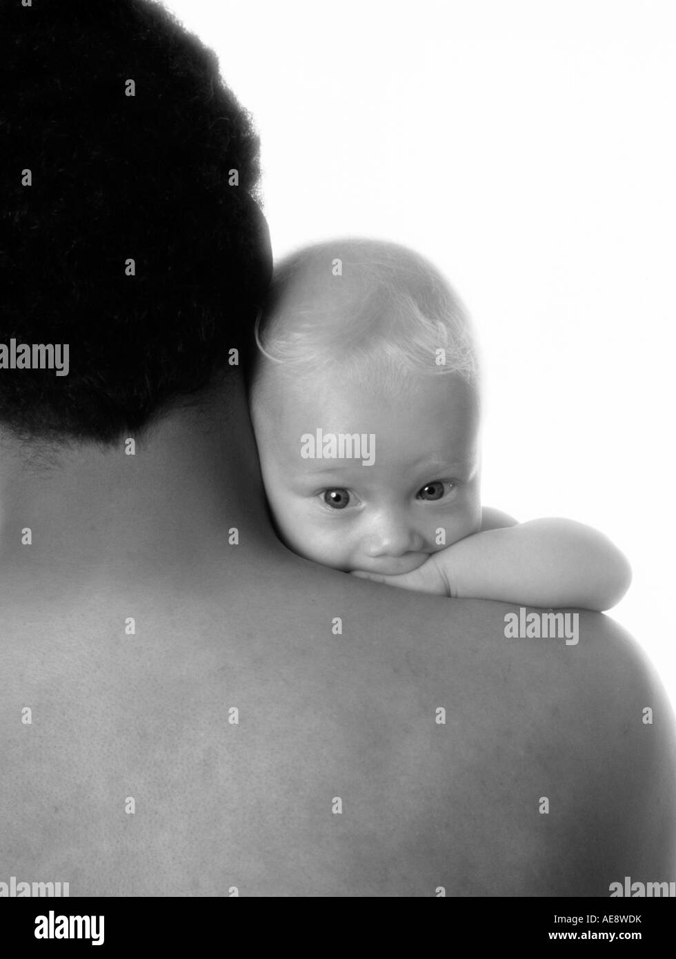 Baby is looking over his fathers shoulder Stock Photo - Alamy