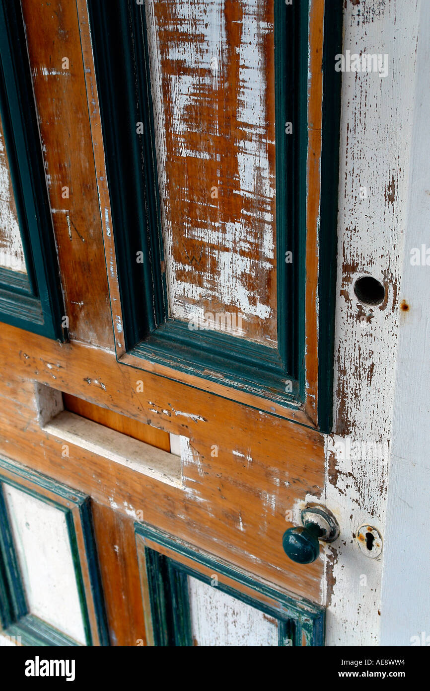 Letter box on a dishevelled door Stock Photo - Alamy