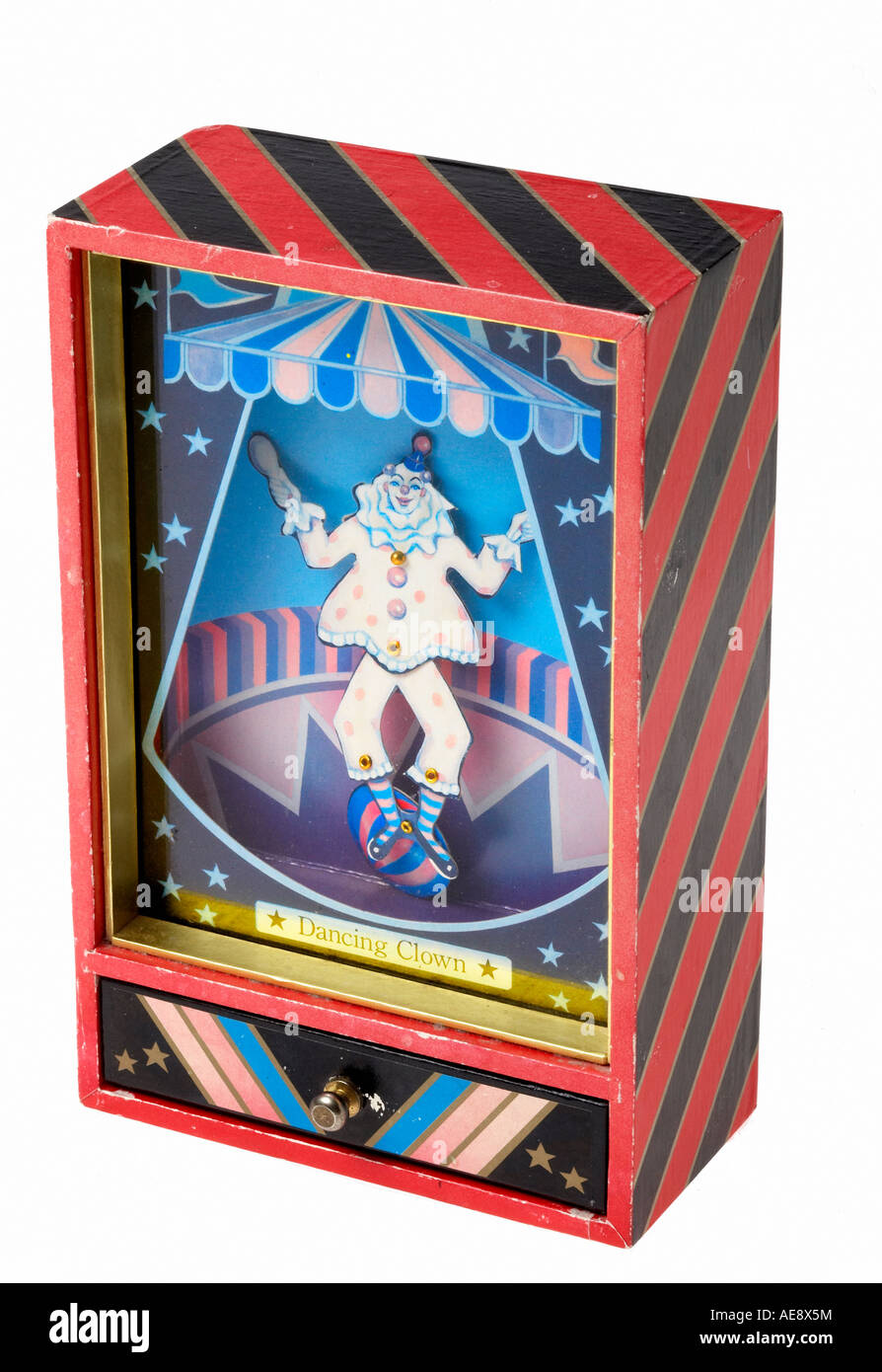 Dancing clown toy silhouetted on a white background Stock Photo - Alamy