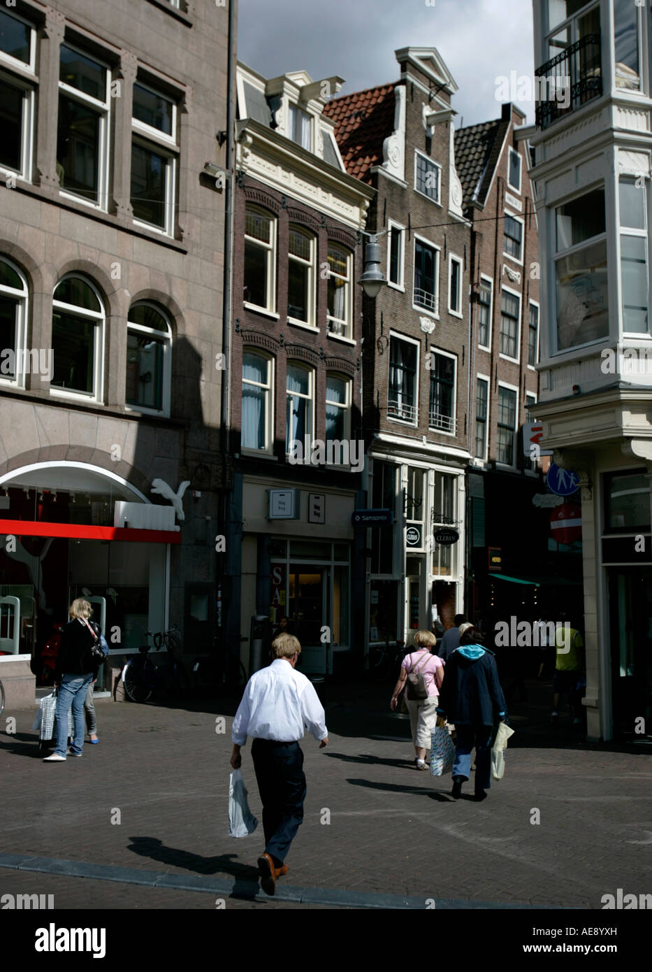 Man walks street in Amsterdam Stock Photo - Alamy