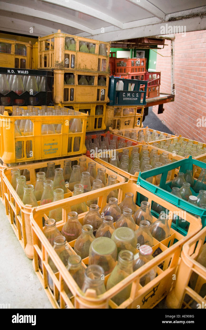 Empty milk bottles on an old Milk Float. Wythall Transport Museum Stock ...