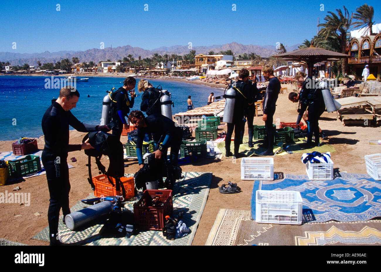 Divers prepare to enter the water Lighthouse Beach Dahab Sinai Egypt ...