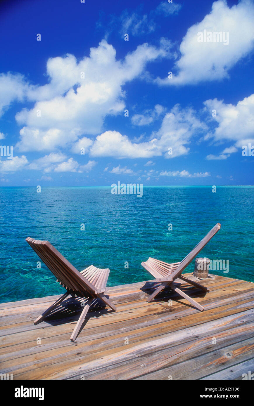Two wooden chairs facing hi-res stock photography and images - Alamy