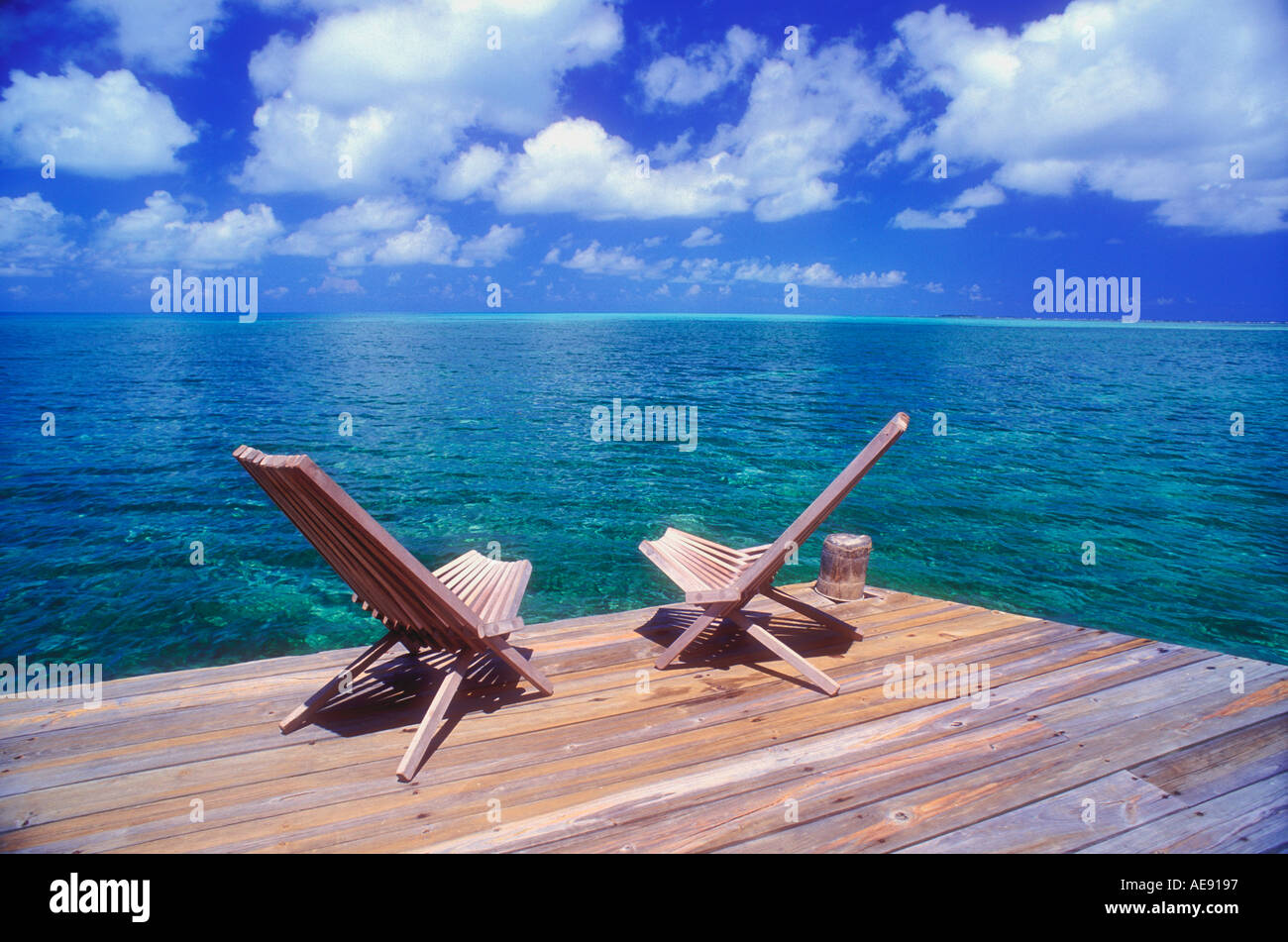 Two wooden chairs facing hi-res stock photography and images - Alamy