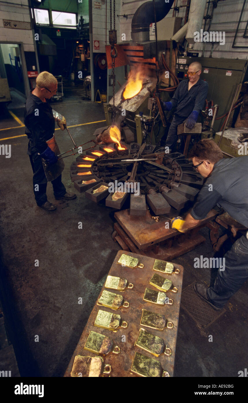 Pouring 99.3% pure gold into anode molds for final purifying, Western ...