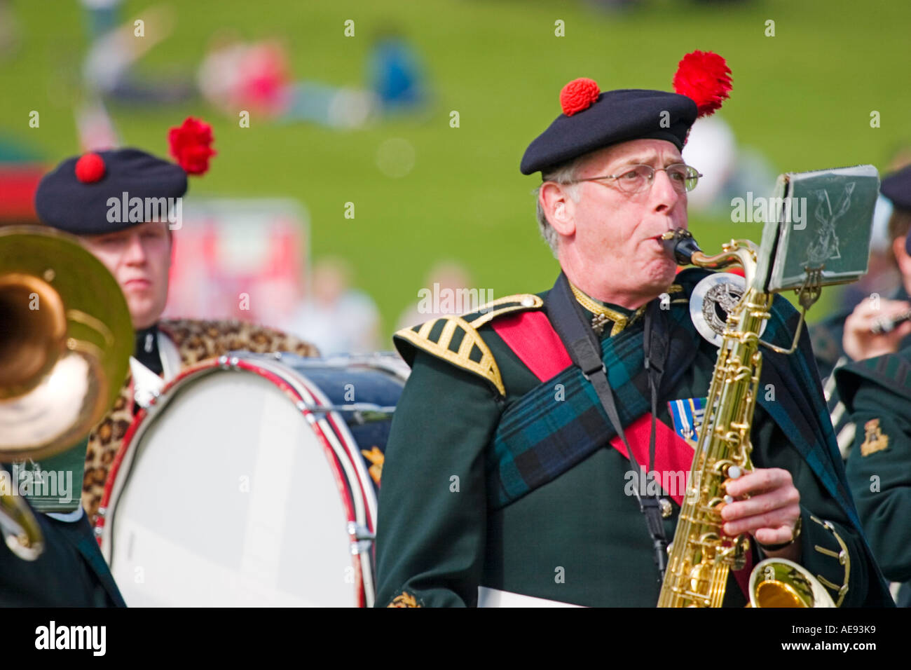 Playing saxophone in Scottish Pipe and Brass Band Stock Photo - Alamy