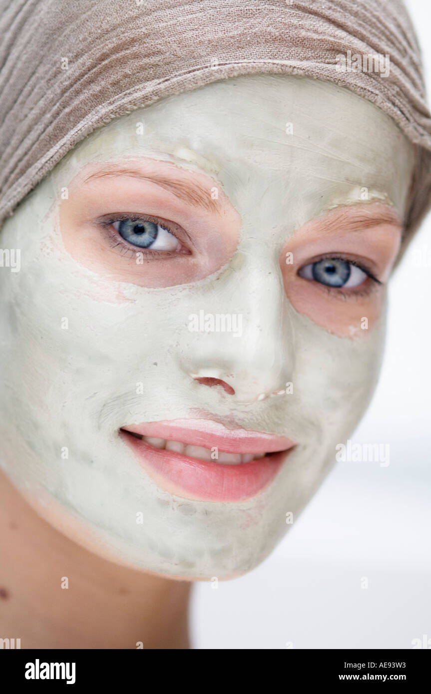 Portrait of a young woman with beauty mask on her face Stock Photo - Alamy