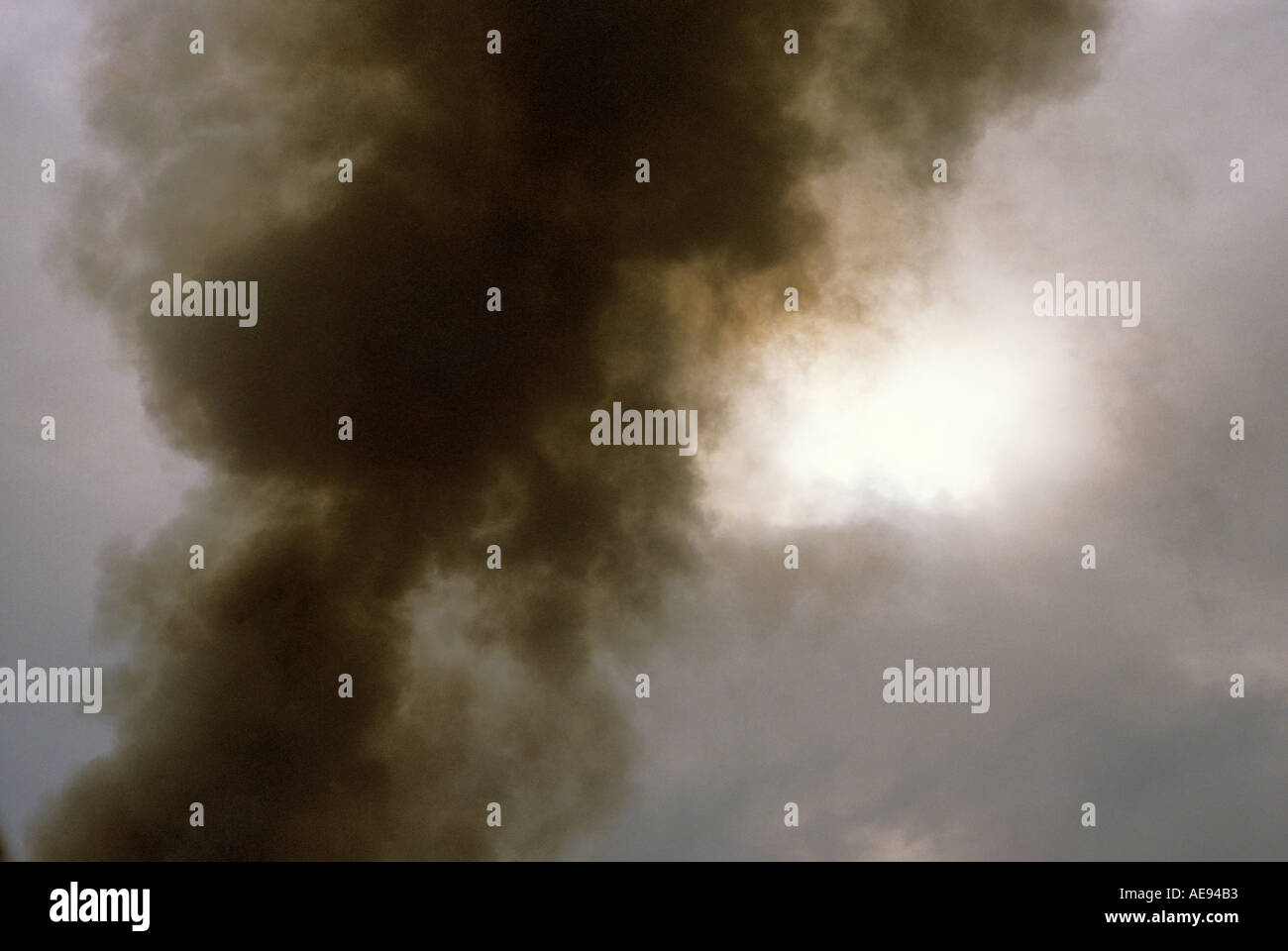 Smoke causing air pollution from burning waste Stock Photo - Alamy