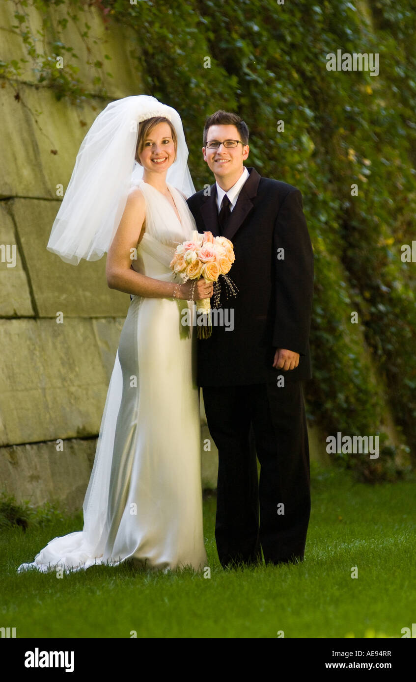 Portrait of bride and bridegroom, full length, outside Stock Photo - Alamy