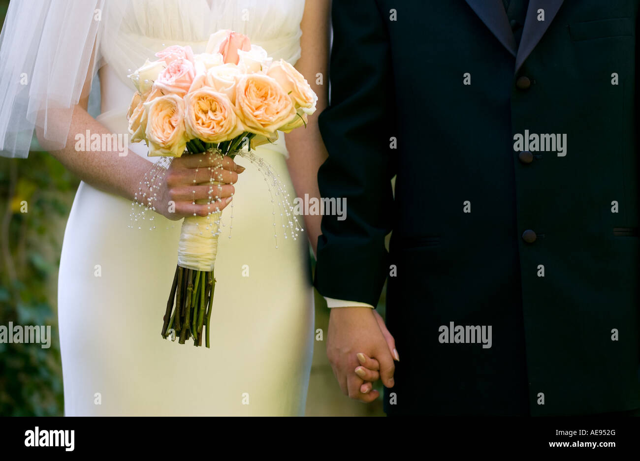 Bride holding her bouquet Stock Photo - Alamy