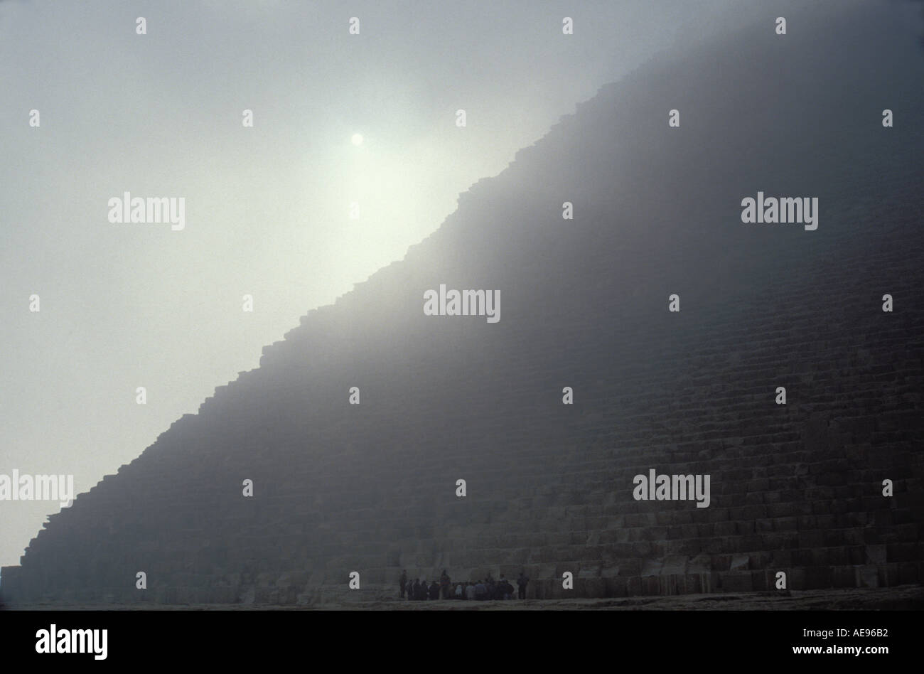 Great Pyramid at dawn with sun emerging from mist Stock Photo - Alamy