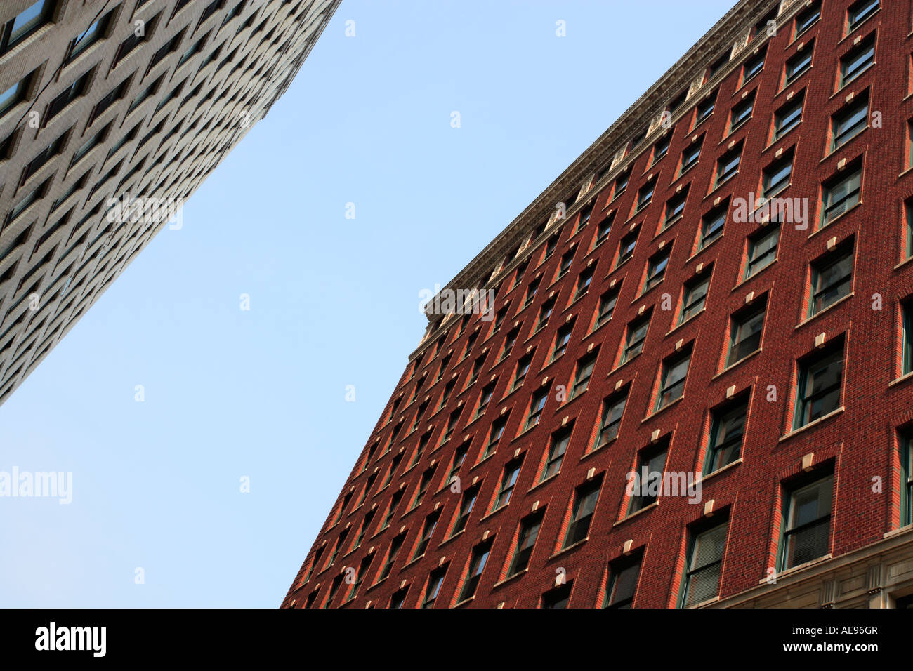 View looking up of two urban high rise buildings Stock Photo - Alamy