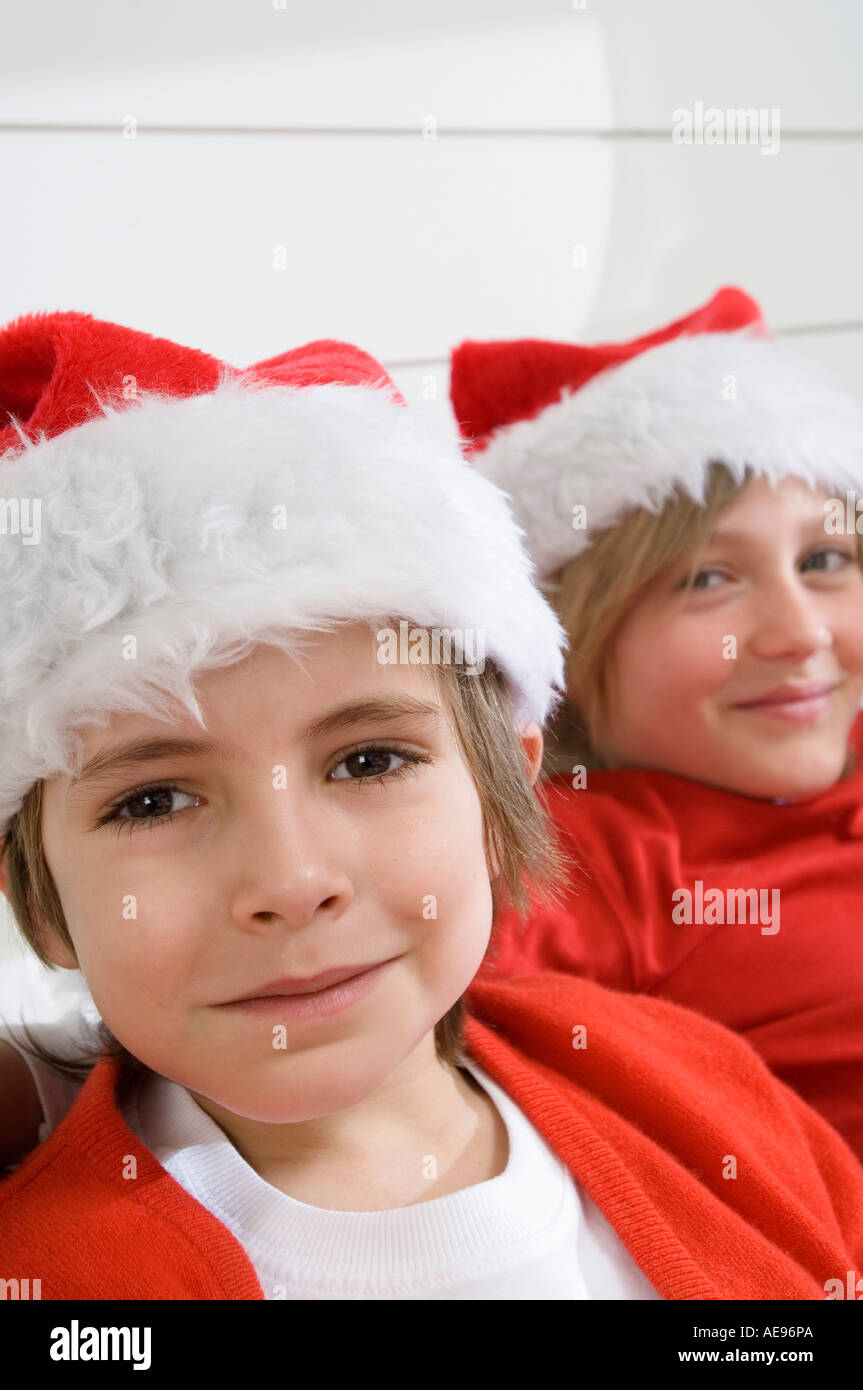 2 boys disguised as Santa Claus Stock Photo - Alamy