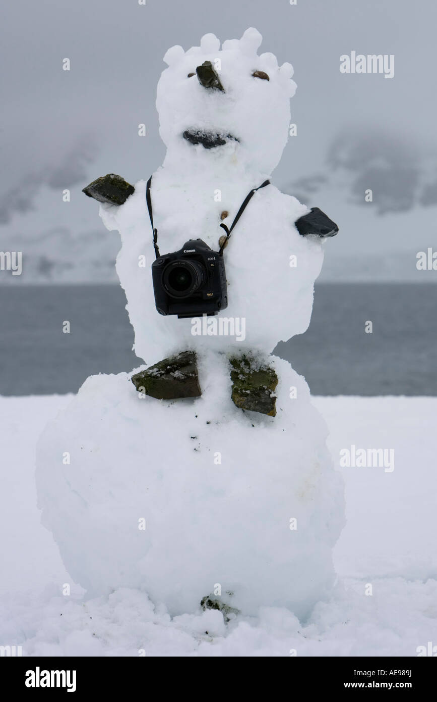 Antarctica Half Moon Island Snowman wearing Canon digital camera on ...