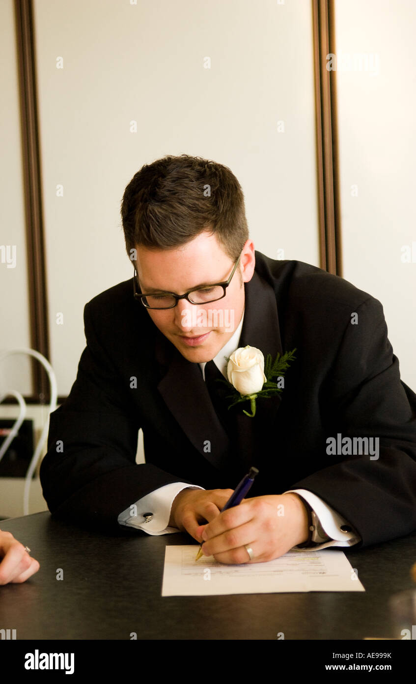 Bridegroom signing the marriage license Stock Photo - Alamy