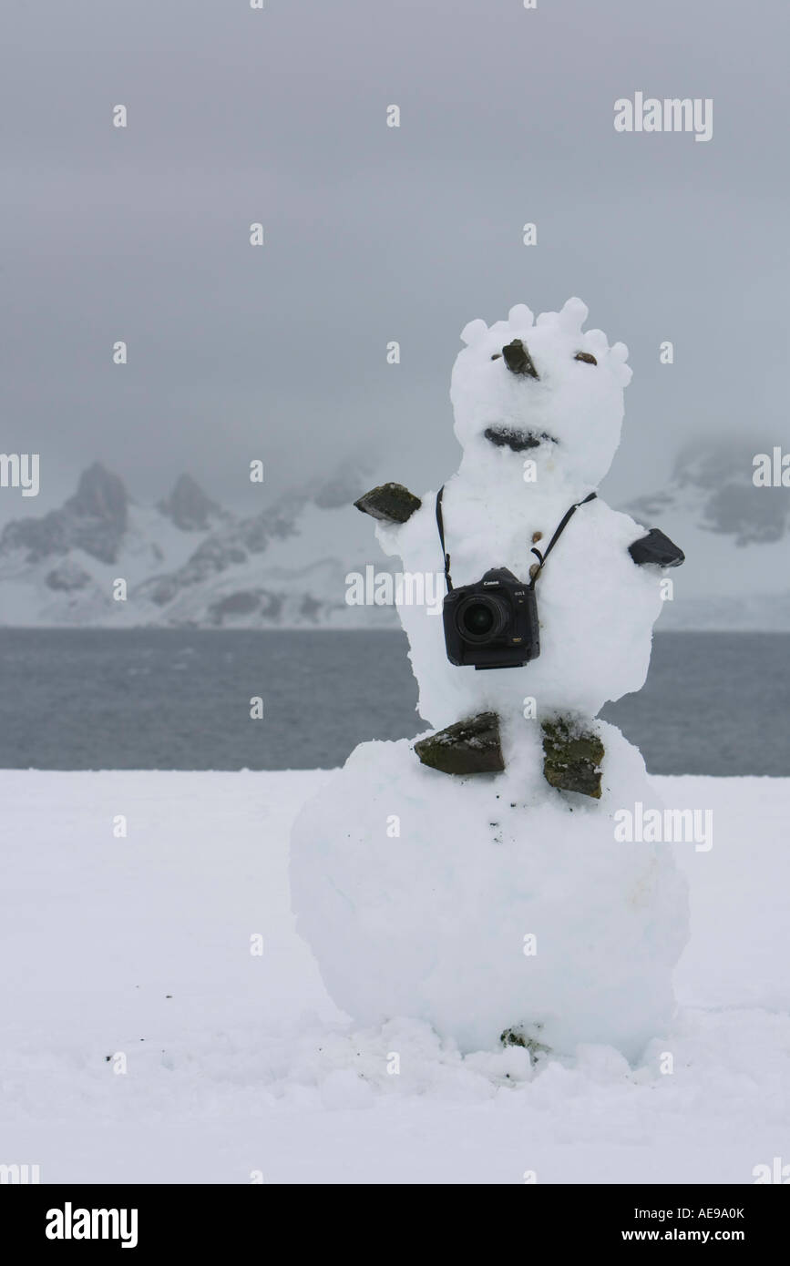 Antarctica Half Moon Island Snowman wearing Canon digital camera on ...