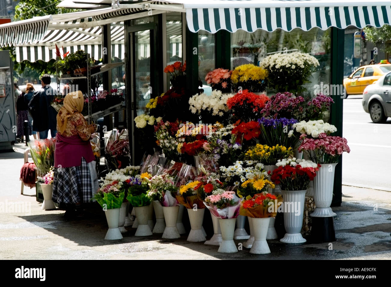 Flower stall and flower old lady at Magheru Boulevard shopping centre ...
