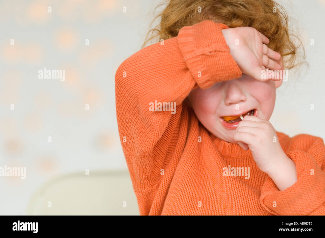 Portrait of a little girl crying, with arm over eyes Stock Photo - Alamy