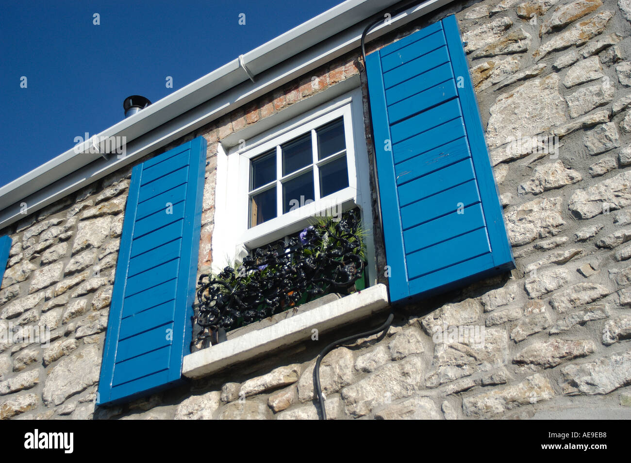 Cottage window blue shutters Cowbridge Wales UK Stock Photo - Alamy