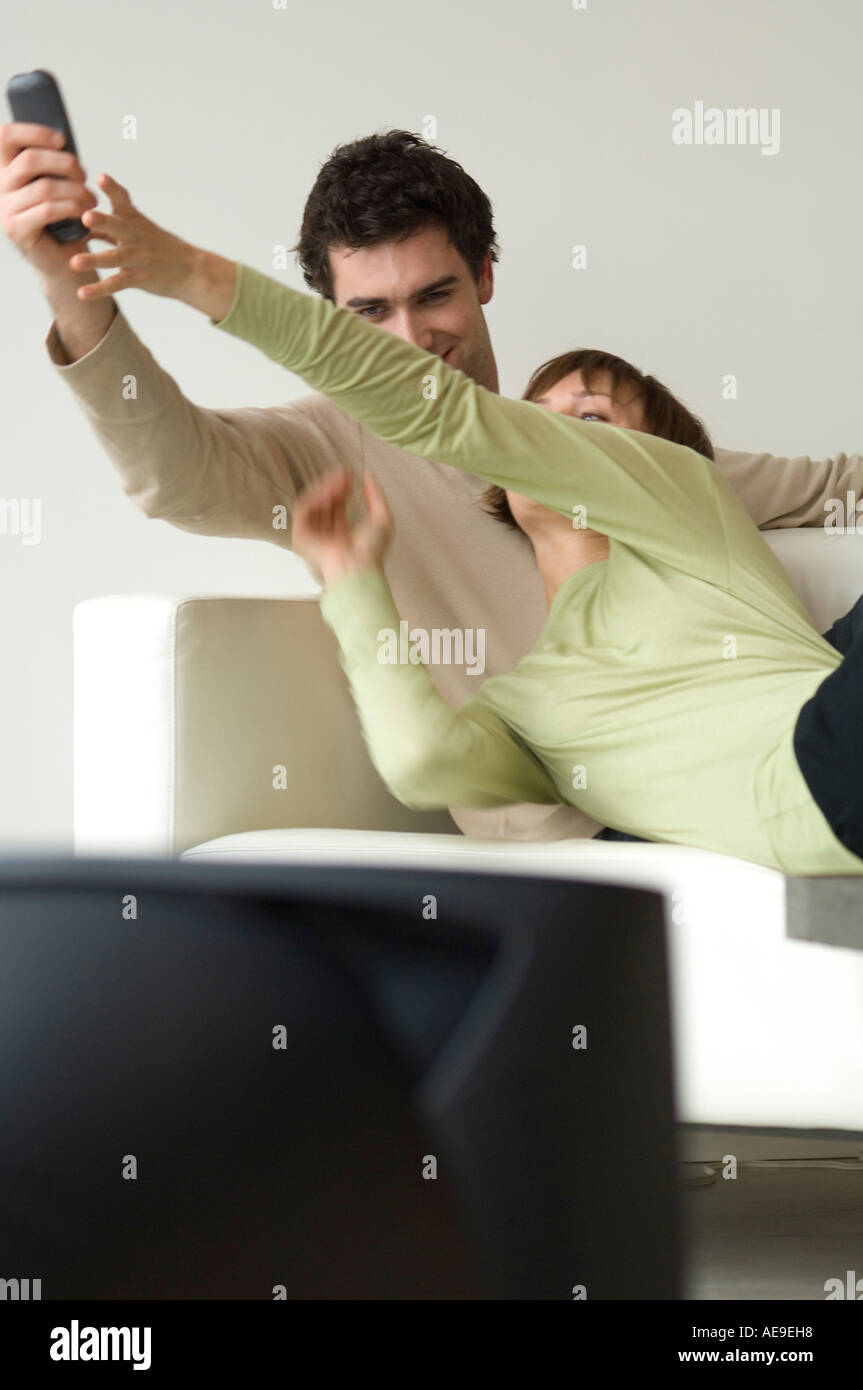 Couple fight remote control hi-res stock photography and images - Alamy