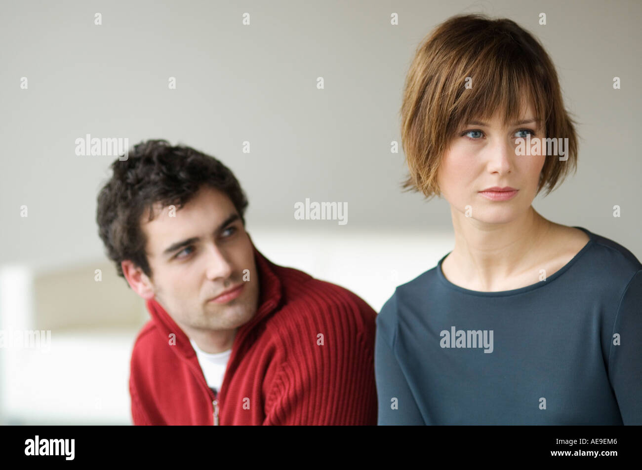 Sad looking couple in living room hi-res stock photography and images ...