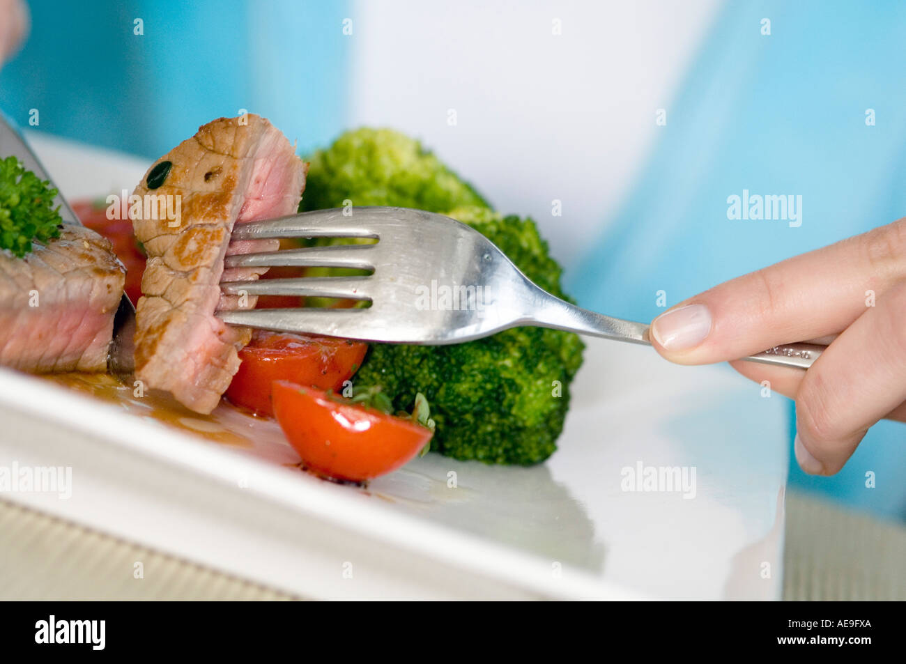 Biting fork woman hi-res stock photography and images - Alamy