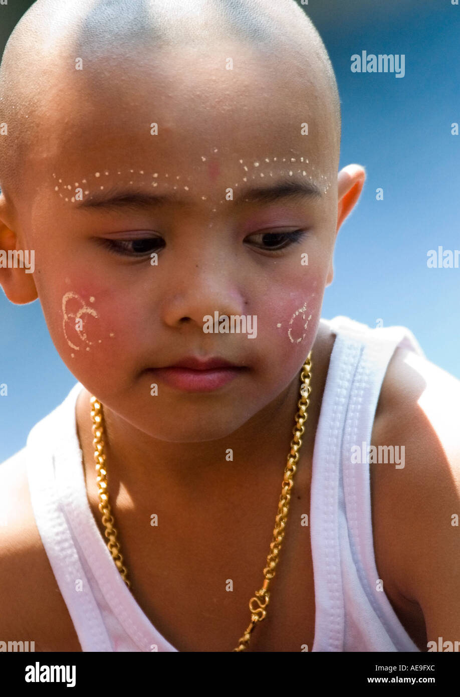 A novice monk wears makeup at Wat Pa Pao during the Poi Sang Long ...